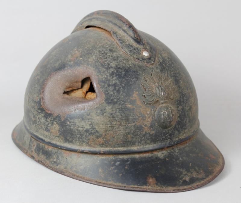 CS Militaria | WW1 French Battle Damaged Adrian Helmet With Shrapnel gash